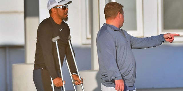 Tiger Woods Seen On Crutches As He Arrives In Los Angeles Presumably