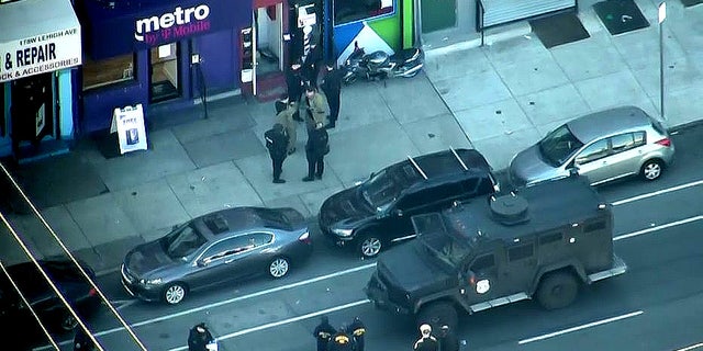 Philadelphia SWAT officer shot in bulletproof vest, suspect in custody ...