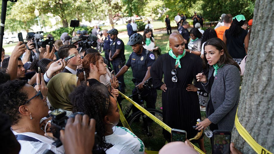 Ocasio Cortez Omar Pretending To Be Handcuffed After Arrest At Protest