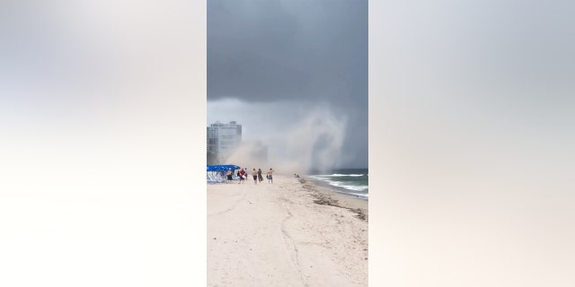 Shocking video shows Florida beach storm throwing umbrellas into the ...