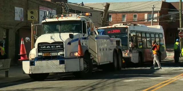 Bus hijacked in NYC, crashes into utility pole; gunman in custody ...