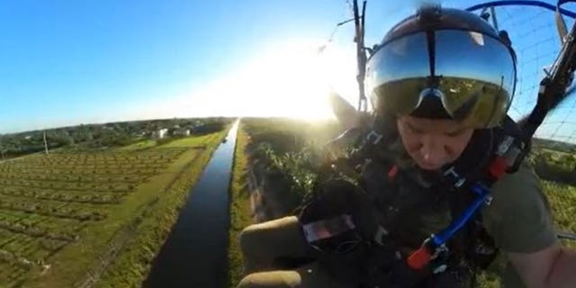 Paraglider helps rescue woman trapped in submerged car in South Florida ...