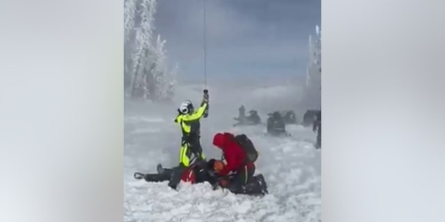 Injured snowmobiler in Utah hoisted to safety after accident on remote ...