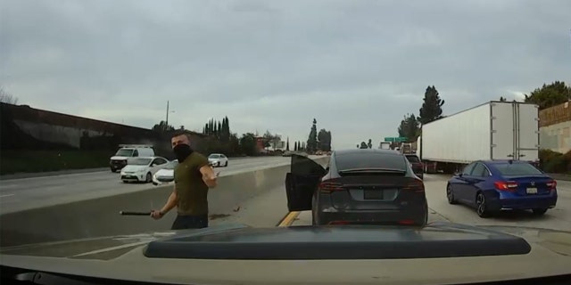 Tesla driver attacks another vehicle on California highway, video shows ...