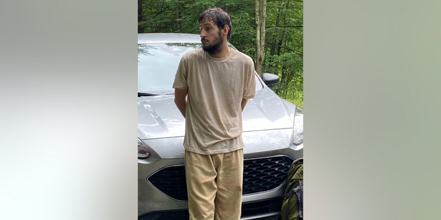 New Photos Show Fugitive Murder Suspect Michael Burham During Arrest