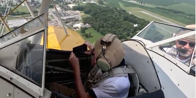 Navy veteran airman, age 100, flies again on vintage World War II pilot ...
