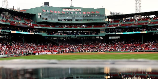 Red Sox fans take advantage of flooded Fenway Park during rain delay ...