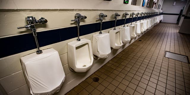 UK dad faces charges for calling out school that removed urinals from ...