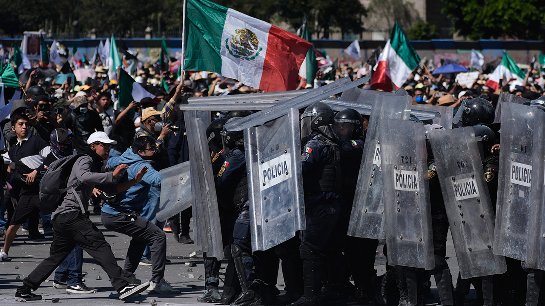 Protesters attack police, breach barrier at Mexico's National Palace ...